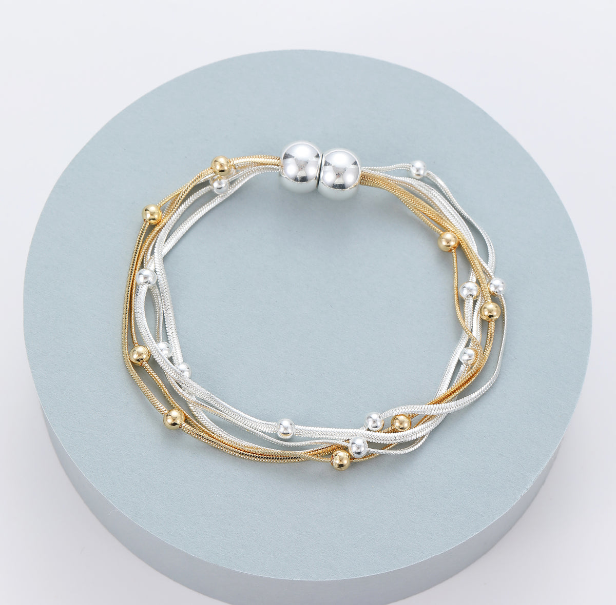 Magnetic bracelet with gold and silver multi-row bead segments ...